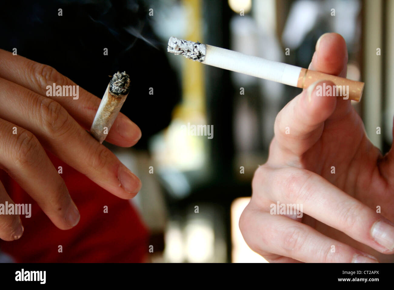 Woman smoking roll up cigarette hi-res stock photography and images - Alamy