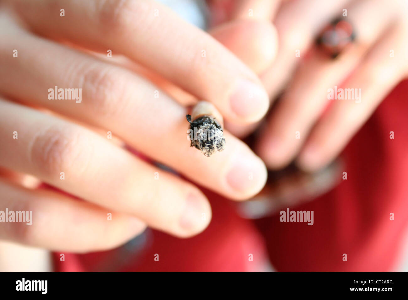 Woman smoking roll up cigarette hi-res stock photography and images - Alamy