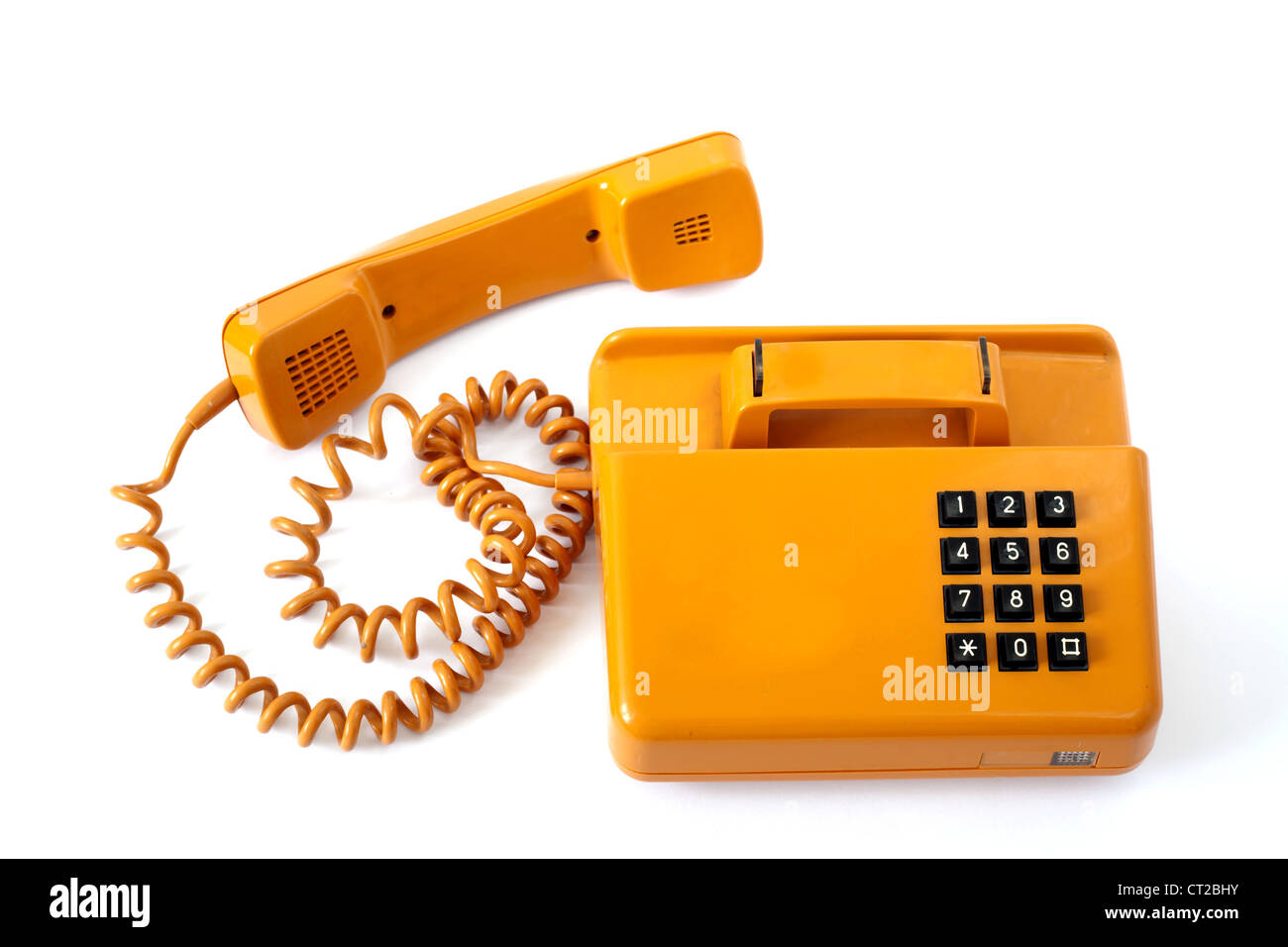 Old orange telephone Stock Photo - Alamy