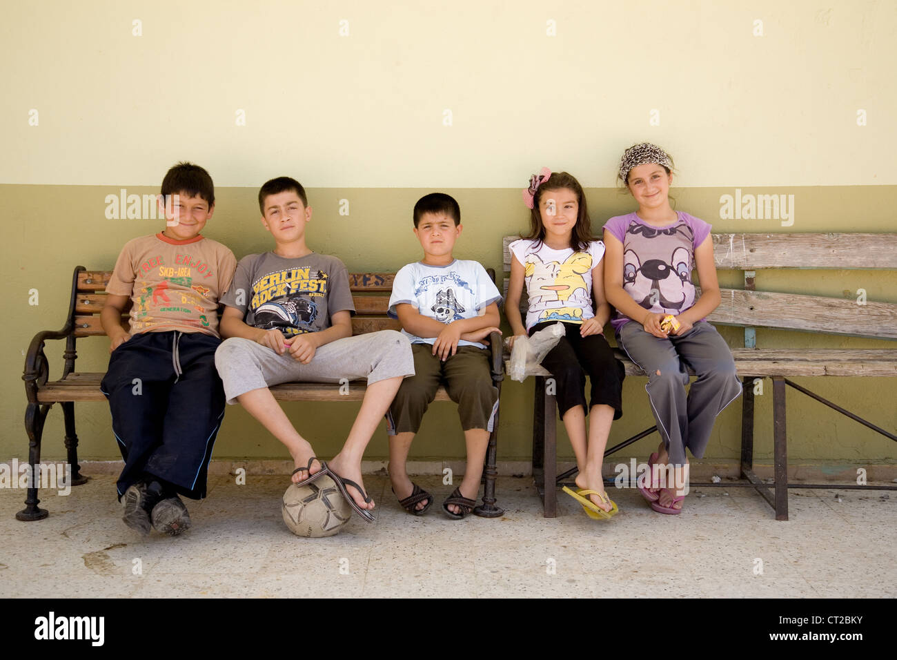 Turkish kids sitting on a couch pose for a photo shoot Stock Photo - Alamy