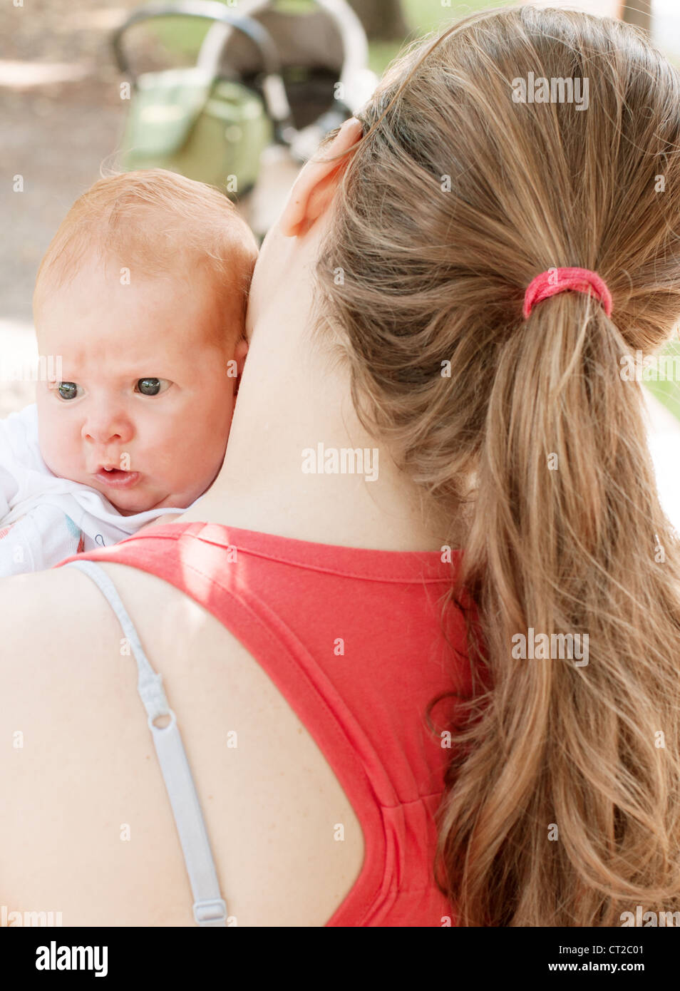Newborn Baby and Mother From Behind Outdoors Stock Photo - Alamy