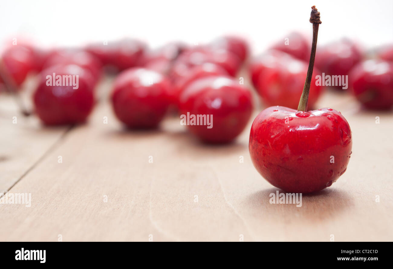 Fresh Red Cherries on Aged Wooden Table - Shallow Depth of Field Stock Photo - Alamy