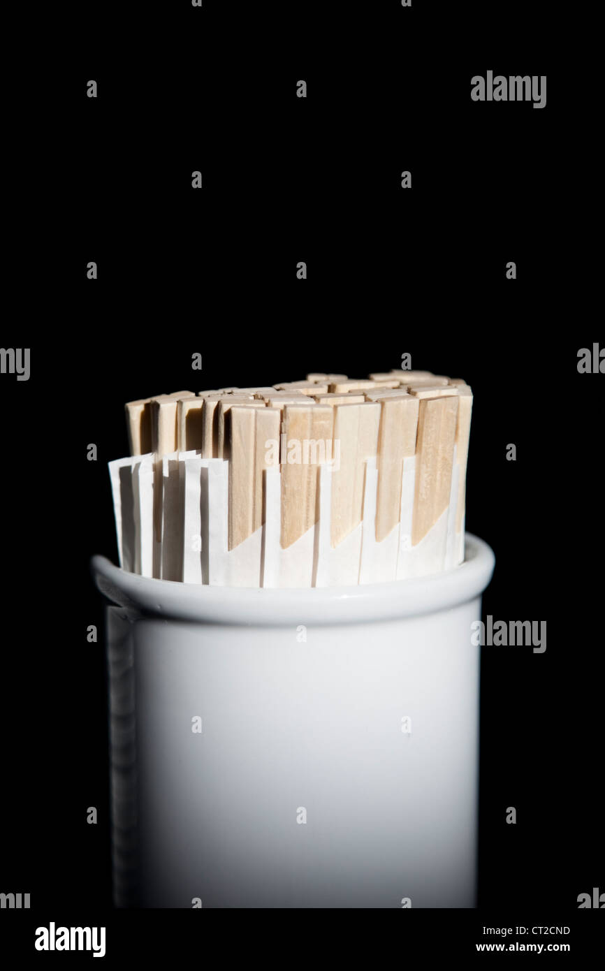 Chinese sticks in a white pot Stock Photo - Alamy