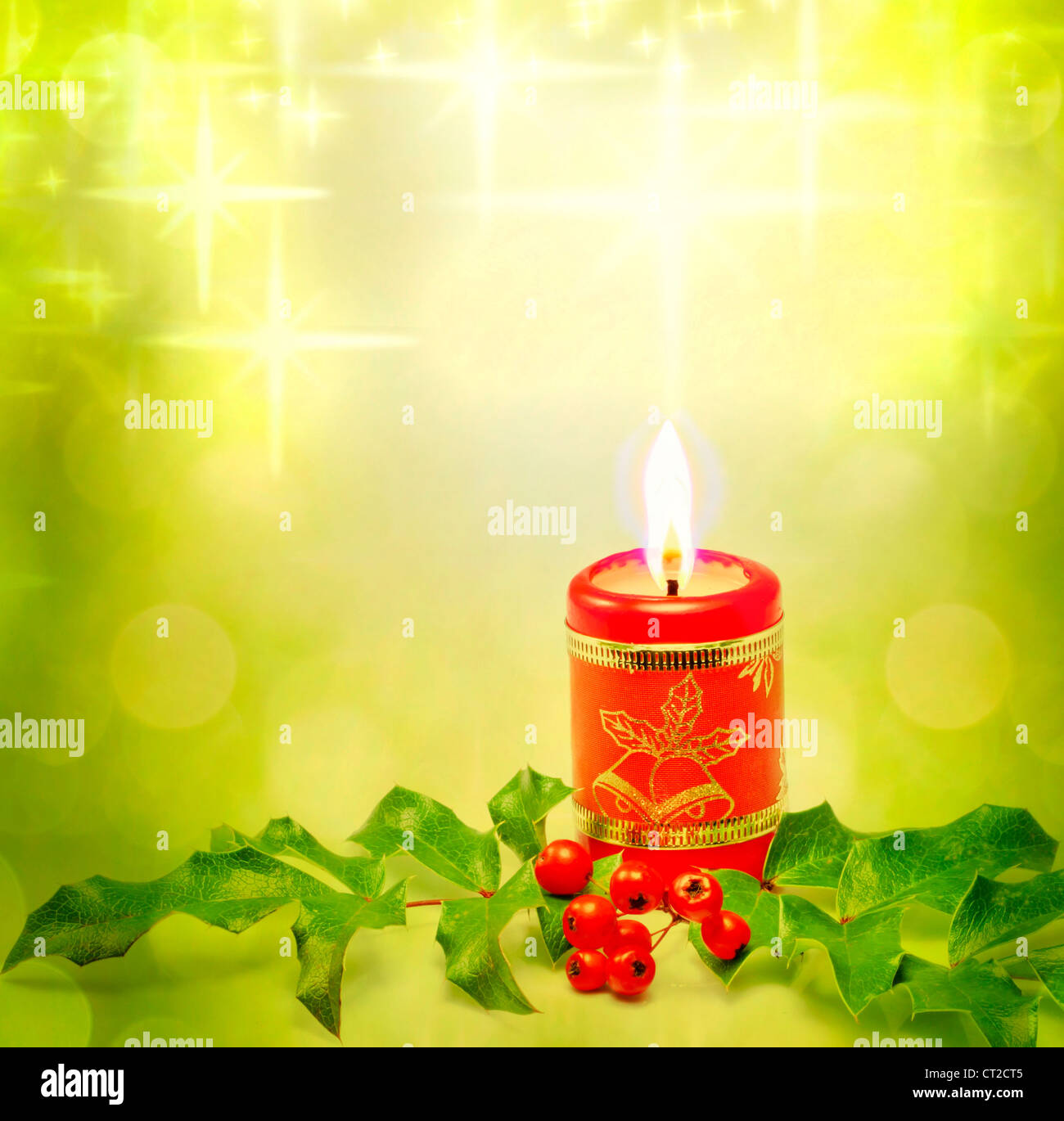 Christmas candle and green tree background Stock Photo - Alamy