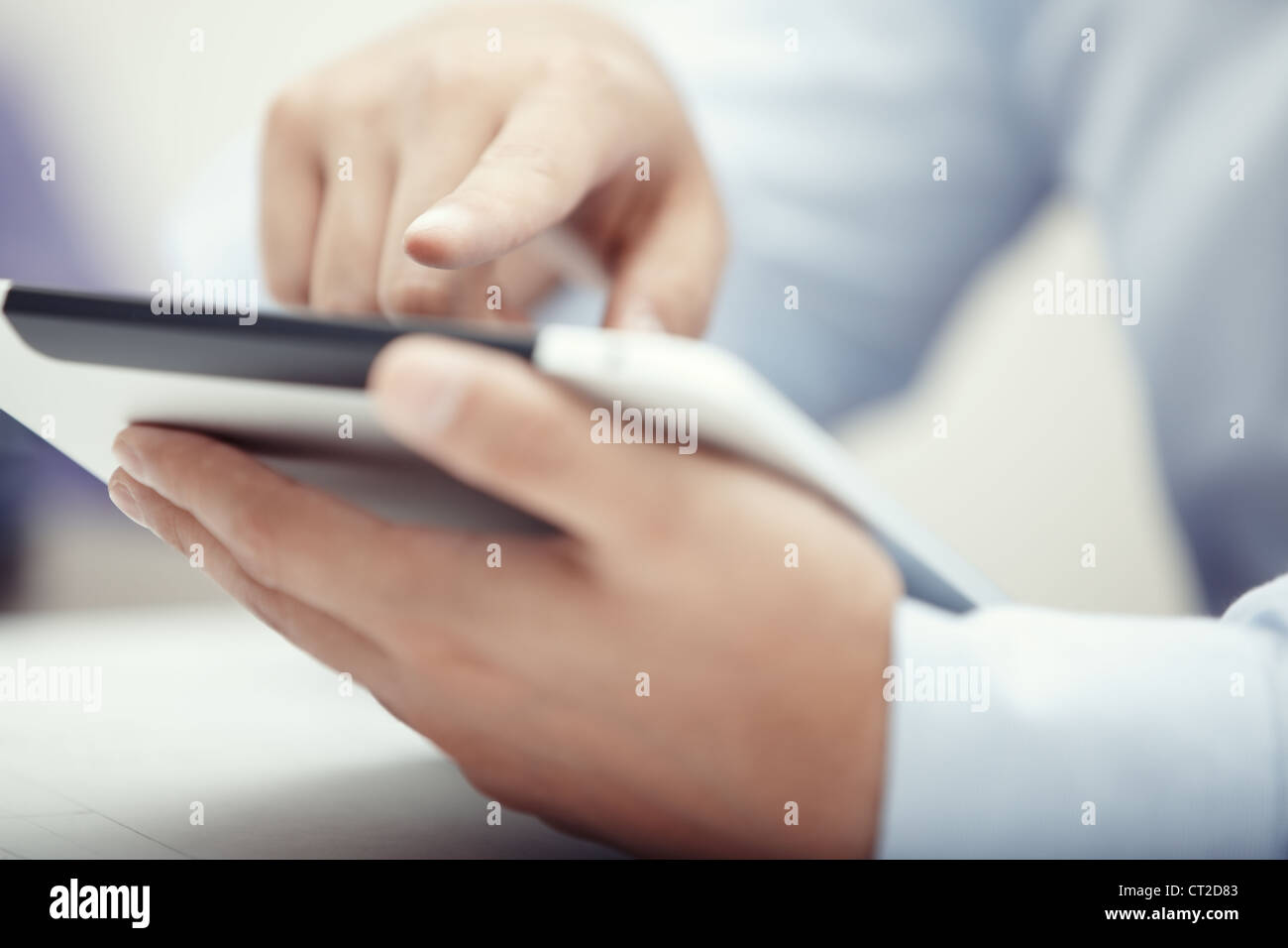 Hands of businessman using tablet PC at office Stock Photo - Alamy