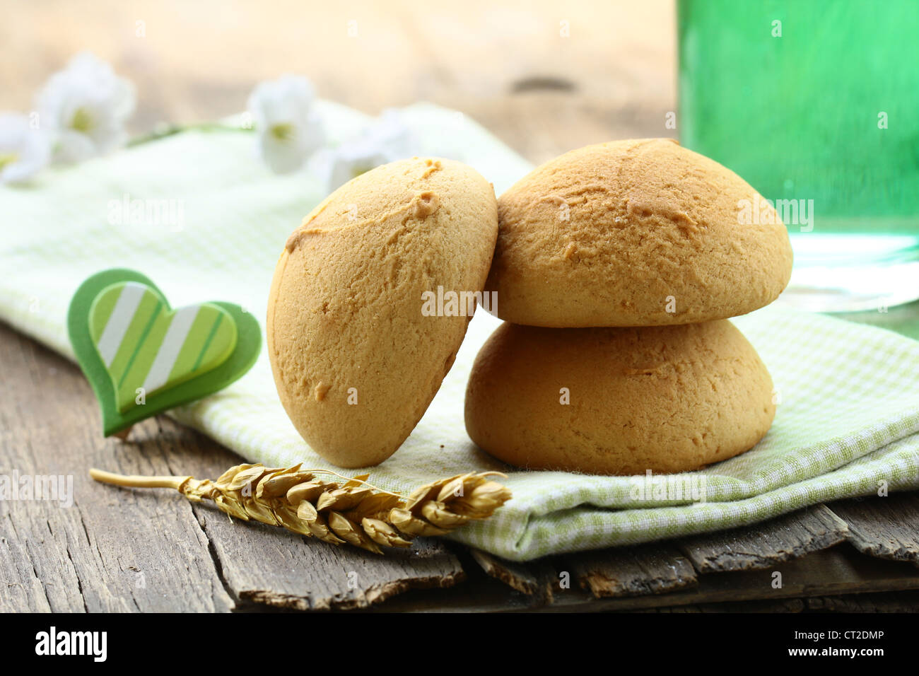 three round biscuits on a wooden table Stock Photo - Alamy