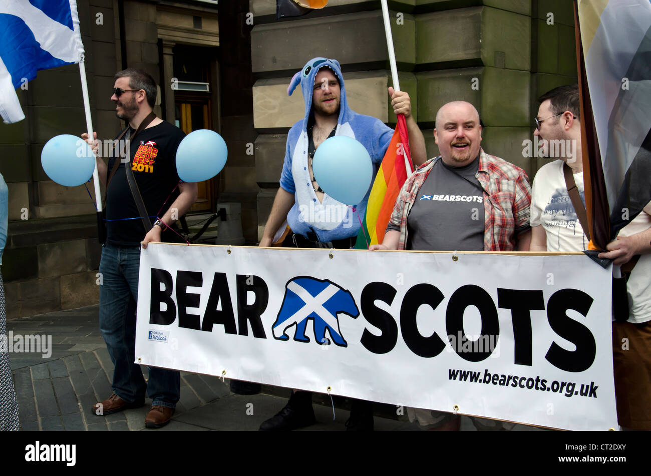 Men carrying a banner before the start of the Pride Scotia 2012 parade ...