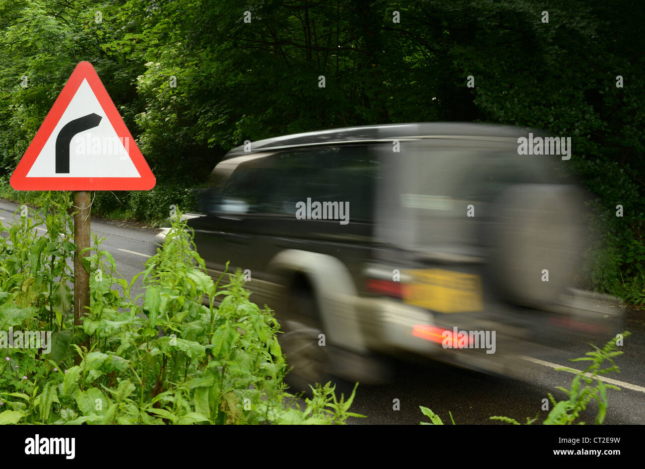 Road sign on approach to a sharp bend Stock Photo - Alamy