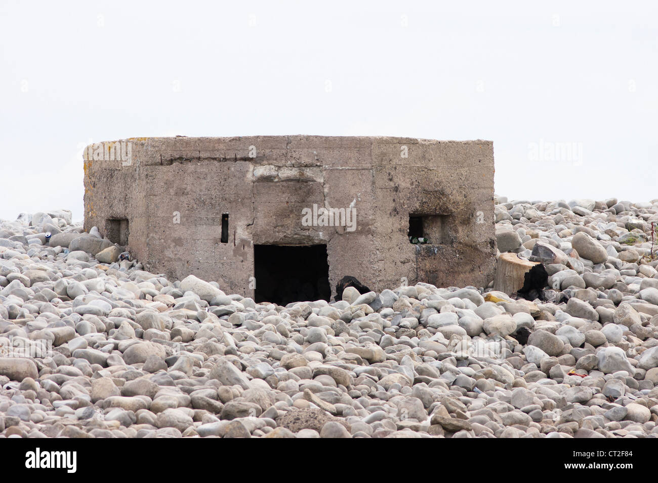 World war two concrete pill box on pebble beach Stock Photo - Alamy
