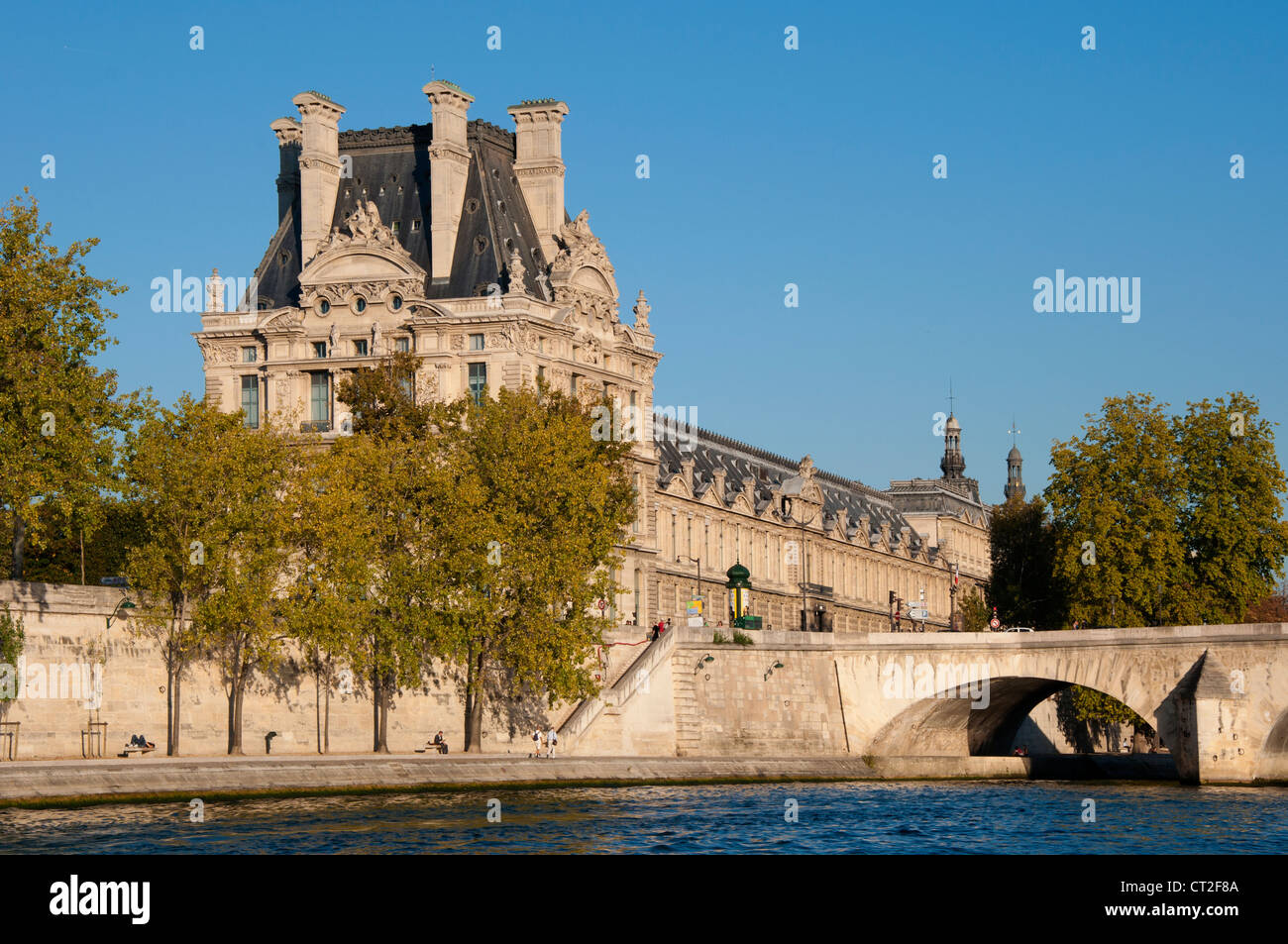 View of the famous museum Louvre from the Seine river. Paris, France ...