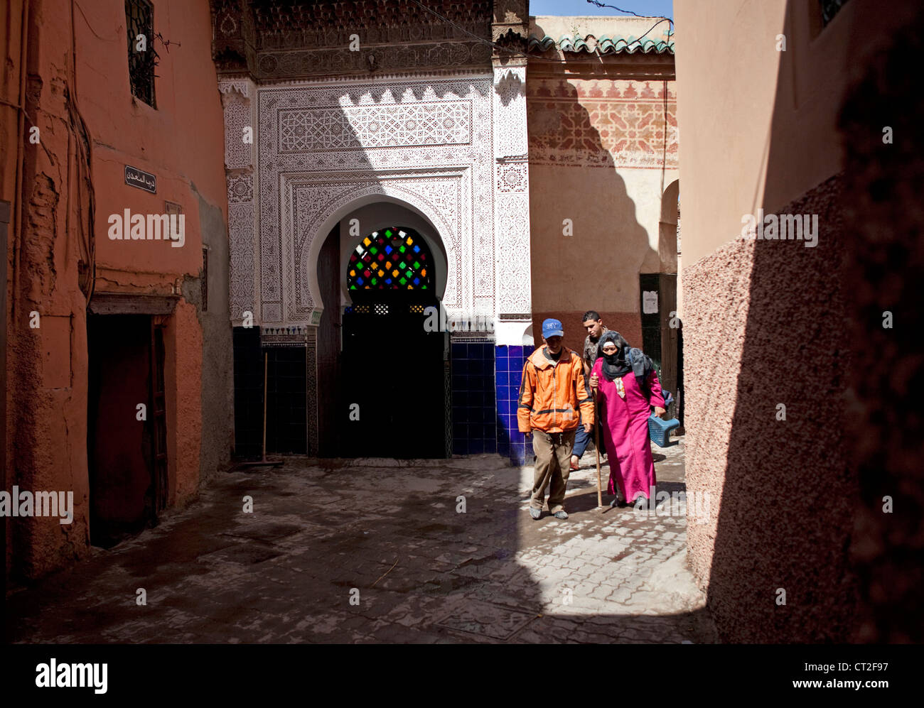 street scene and mosque entrance in the medina of marrakech Stock Photo ...