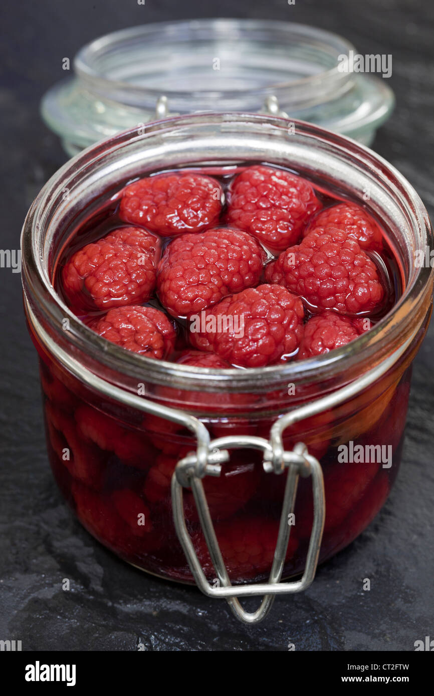 Raspberries in Glass Storage Jar Stock Photo - Alamy