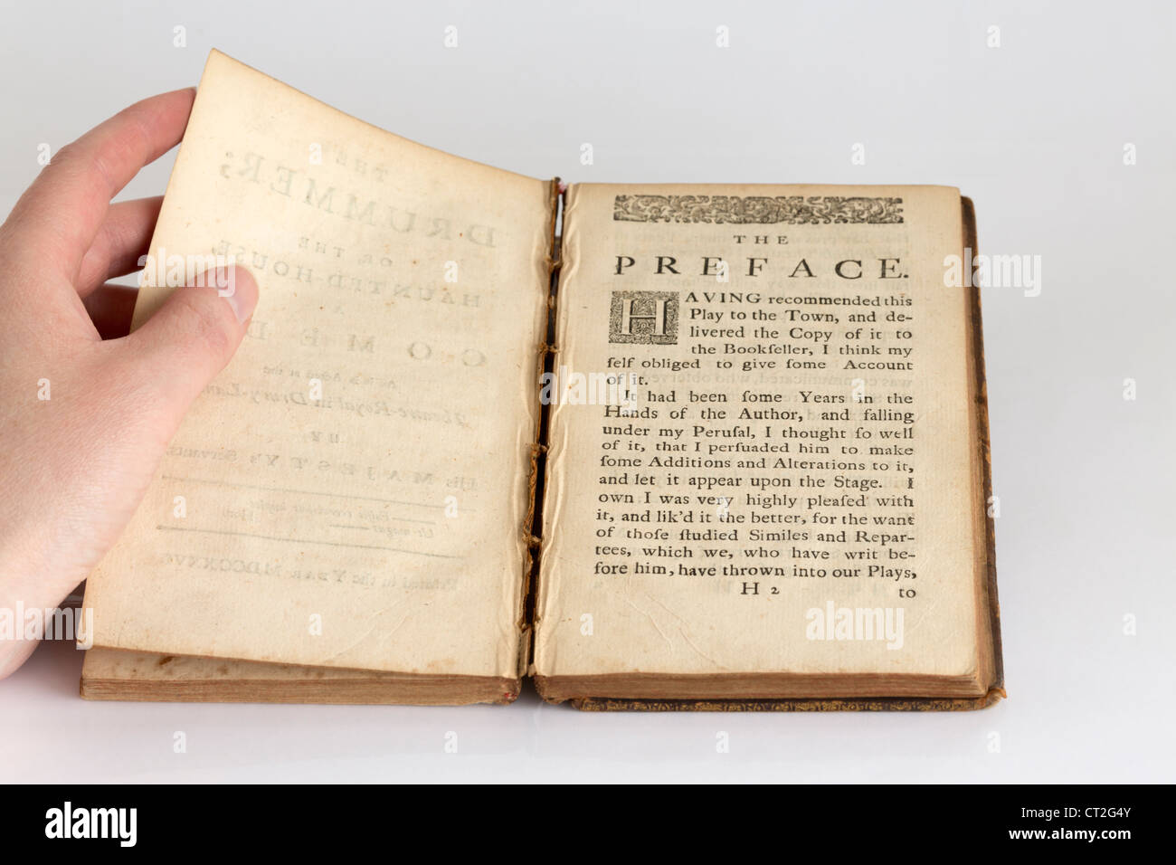 Turning pages of an old book Stock Photo - Alamy