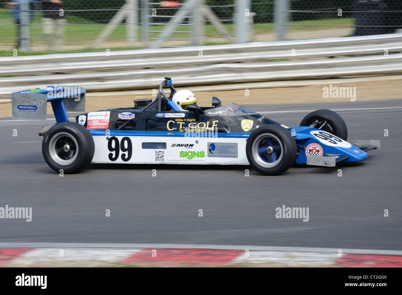 blue race car on race track Stock Photo - Alamy