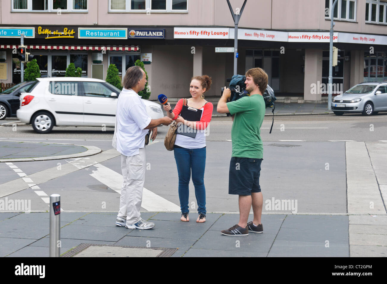 TV Team Male Cameraman Female Reporter Interview on Street interviewing ...