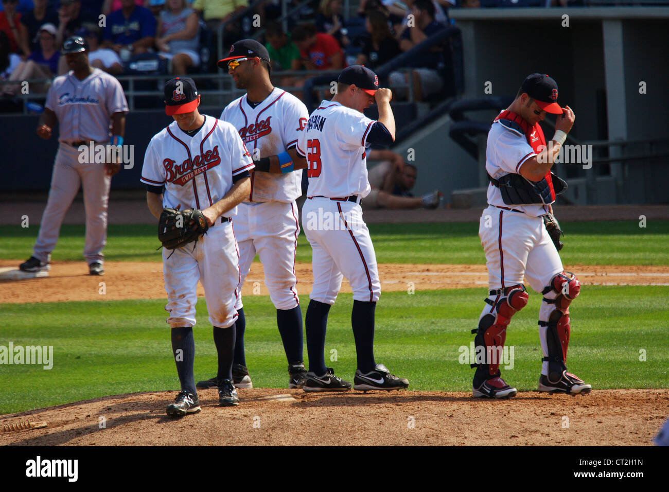 Pitching Change. Players meet on the mound for a pitching change Stock ...