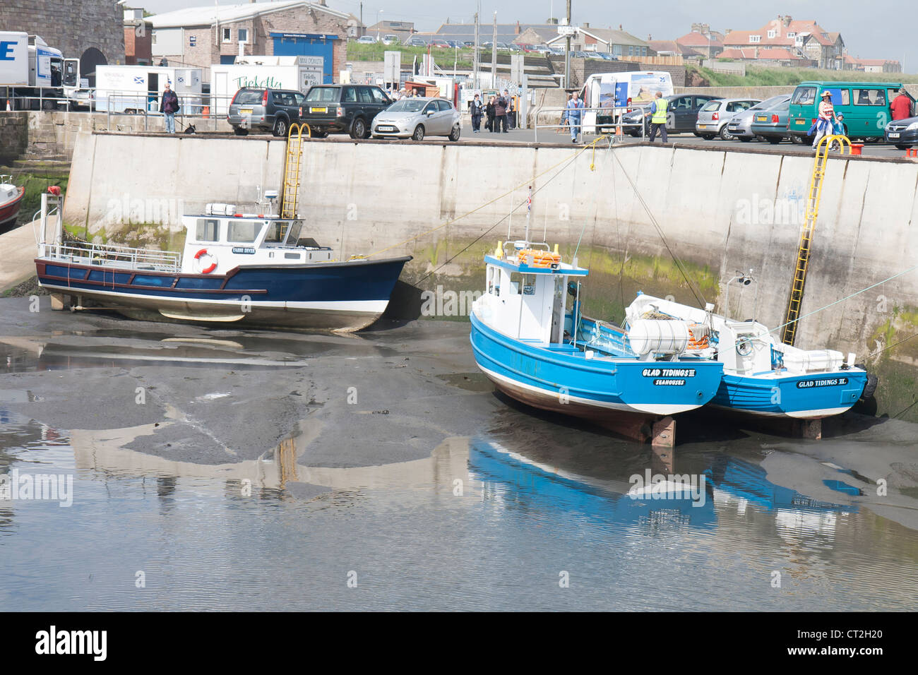 Seahouses Harbour with the boats for the Farne Islands - tide is out ...