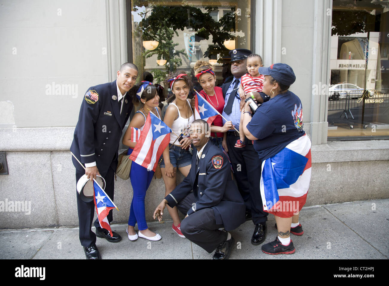 Puerto Ricans happily pose for photos during the Puerto Rican Parade in ...