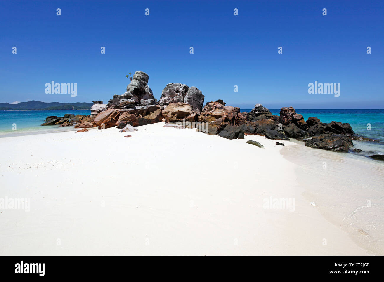 Rocks and rock formations on the tropical sandy beach of Khai Nai ...