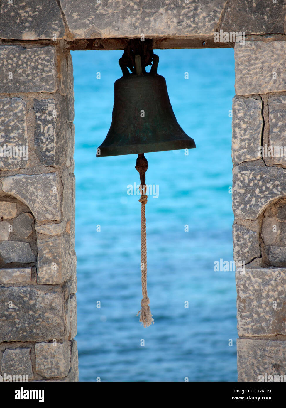 A bell by the sea in Greece Stock Photo - Alamy