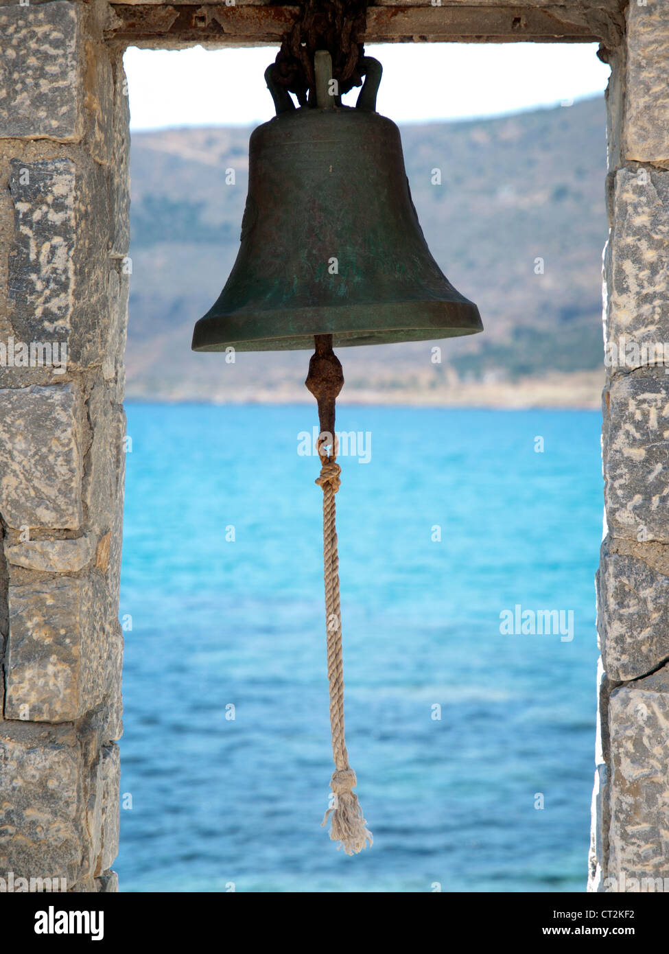 A bell by the sea in Greece Stock Photo - Alamy