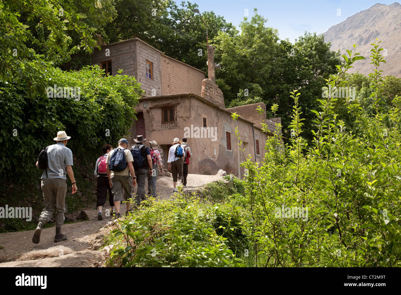 Tourists walking in the HIgh Atlas mountains near Imlil, Morocco ...