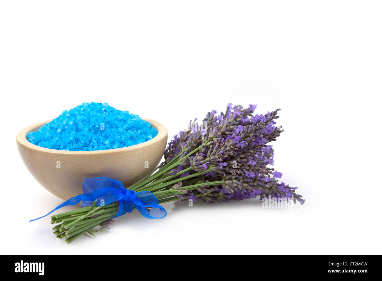 blue organic salt for spa with lavender flowers on a white background ...