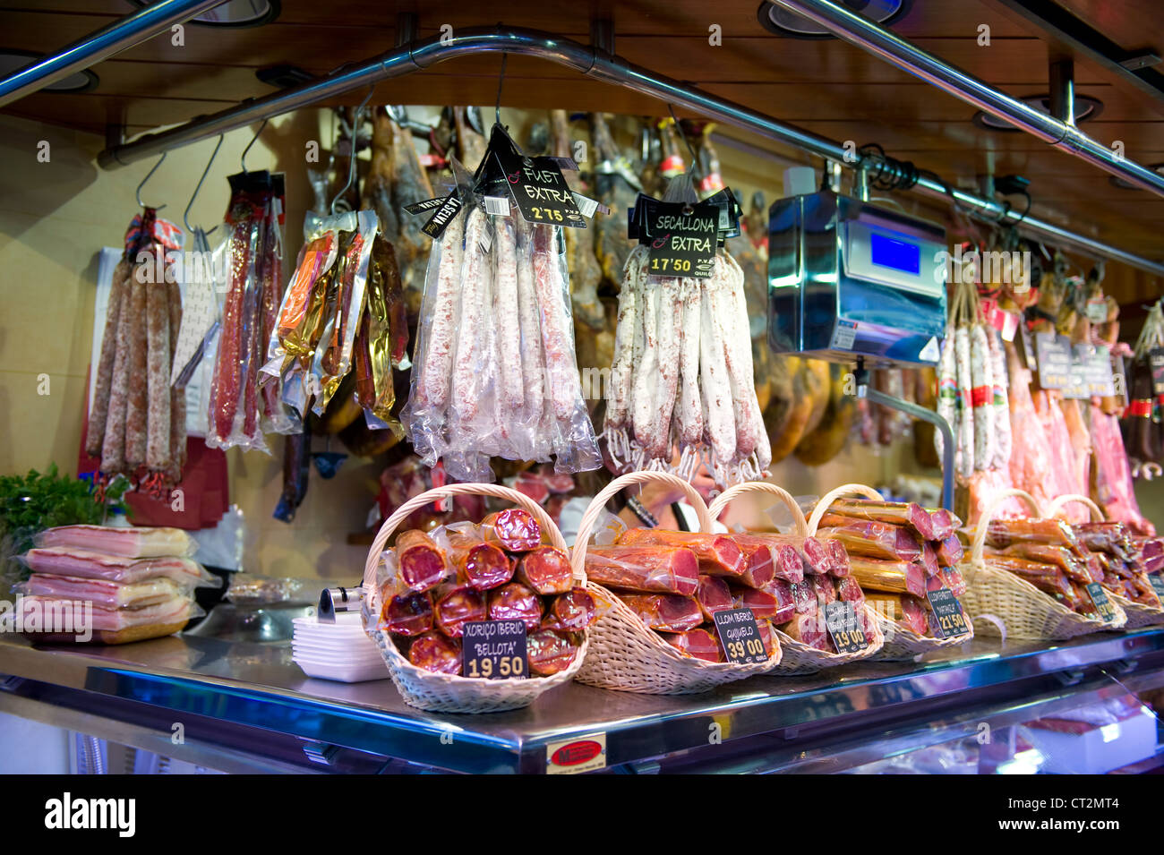 Market of la Boqueria barcelona iberian ham stall Stock Photo - Alamy