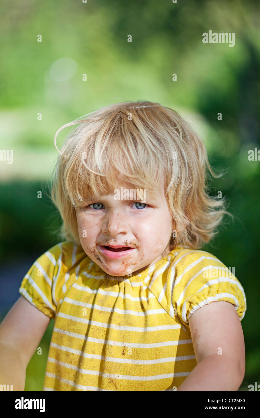 Girl outside with dirty face Stock Photo - Alamy