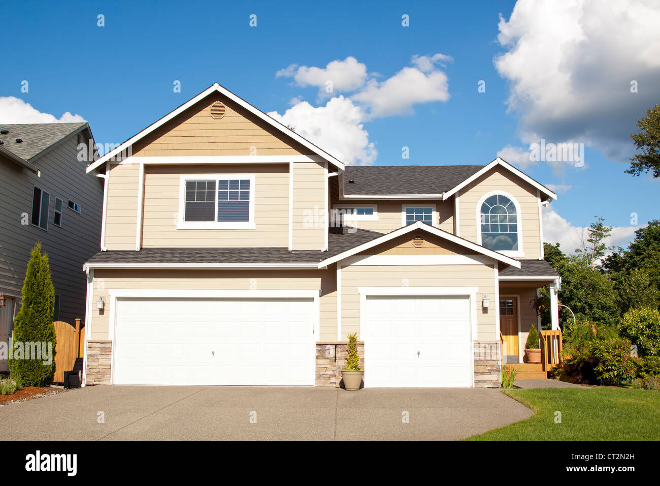 new beautiful suburban house with blue sky and clouds Stock Photo - Alamy