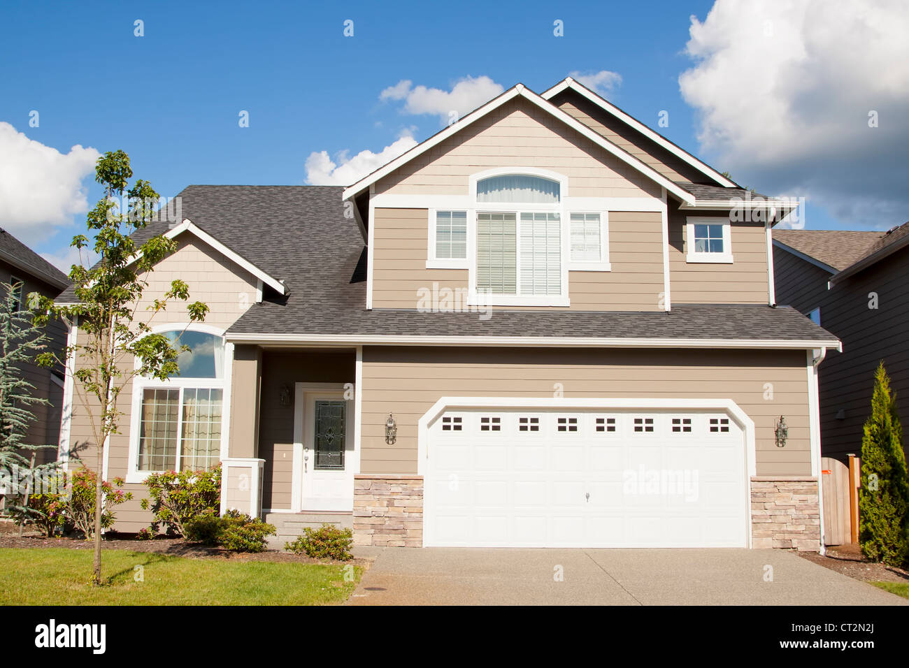 new beautiful suburban house with blue sky and clouds Stock Photo - Alamy