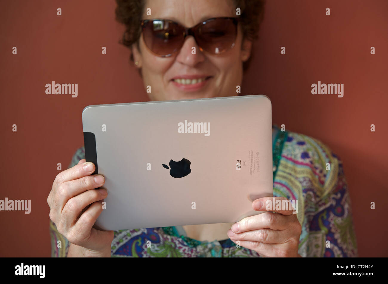 Woman using Apple iPad Stock Photo - Alamy