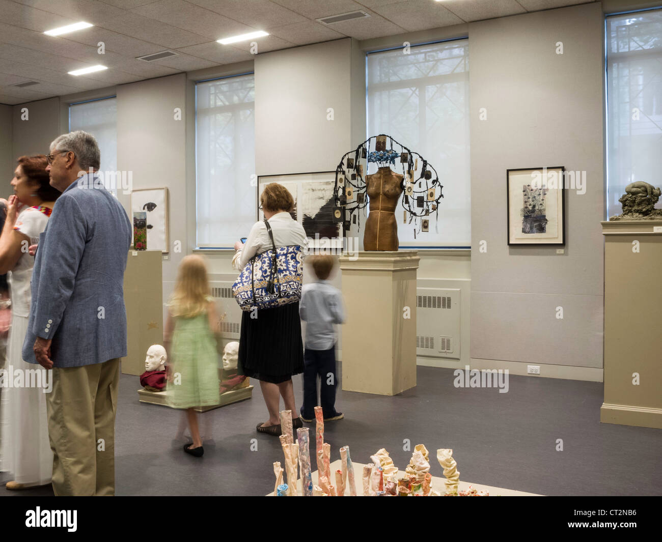 Patrons at an art show, NYC Stock Photo - Alamy