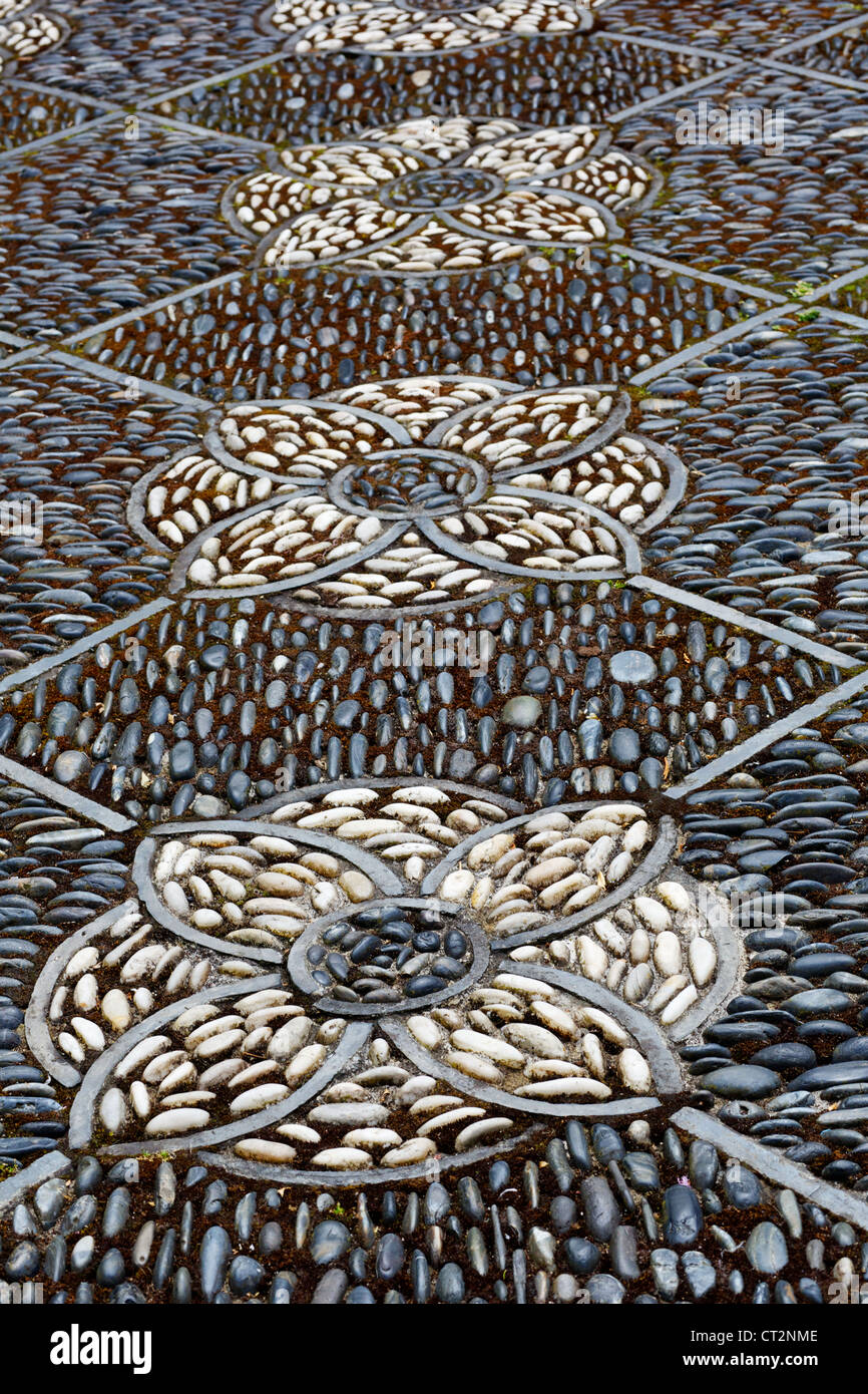Intricate pathway of an Asian stone mosaic patio Stock Photo - Alamy
