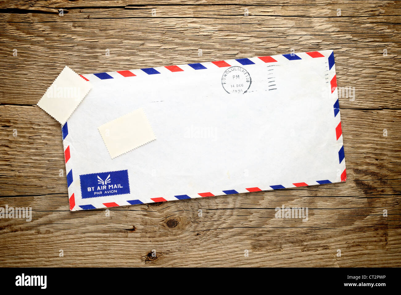 Old envelope on wooden background Stock Photo - Alamy