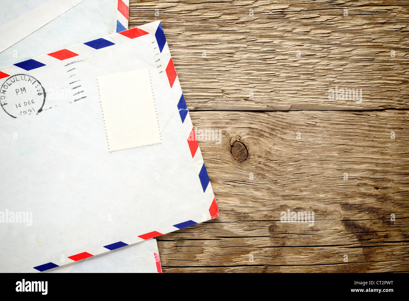 Old envelope on wooden background Stock Photo - Alamy