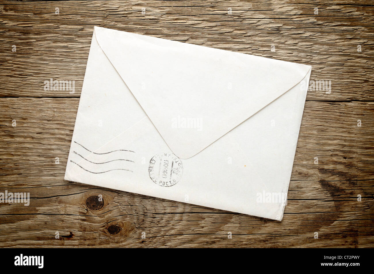 Old envelope on wooden background Stock Photo - Alamy