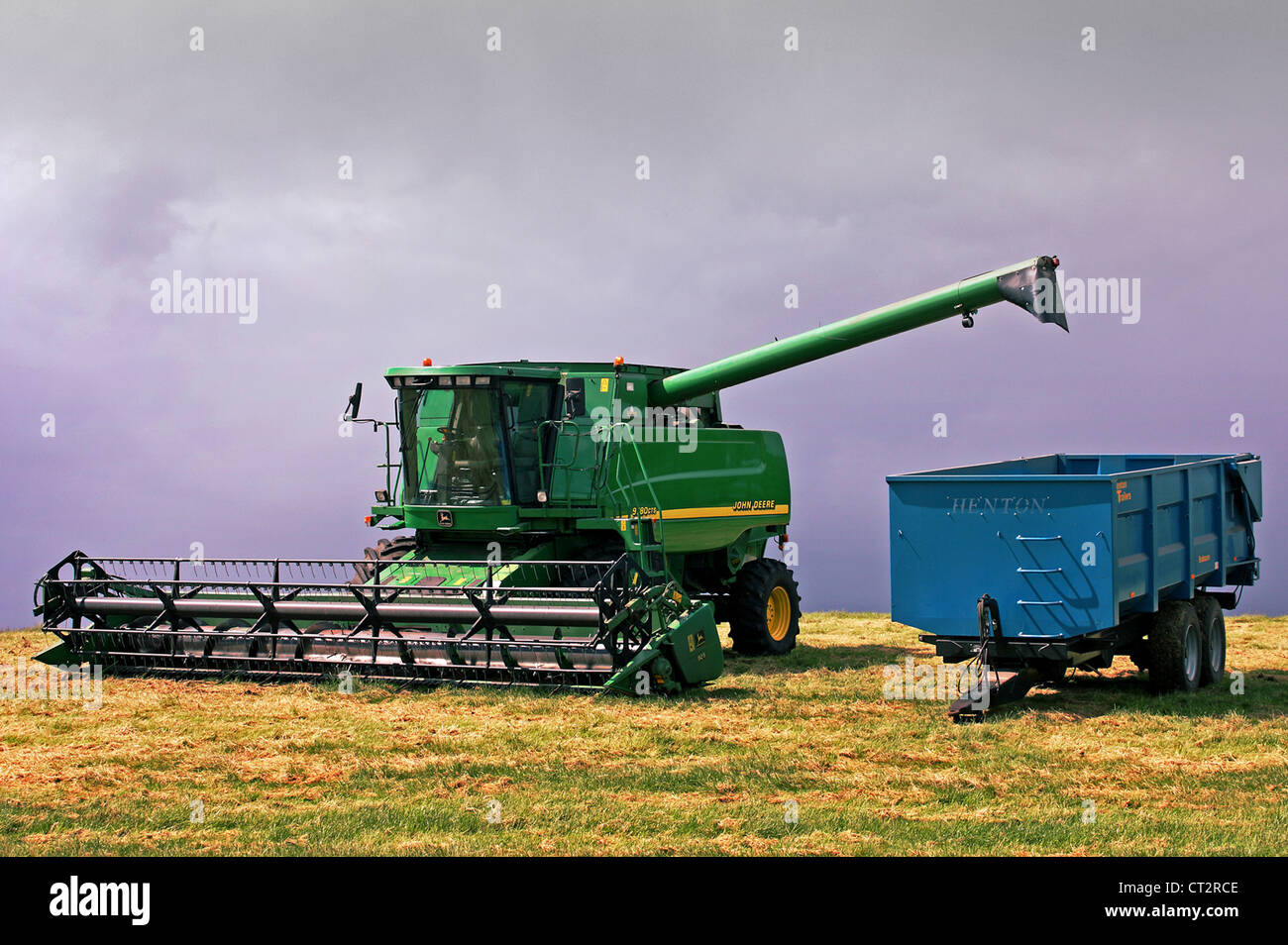 Combine harvester in a field Stock Photo - Alamy