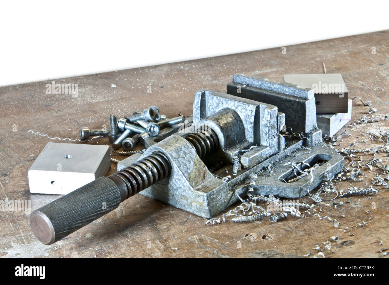 A metal vice on a wooden workbench isolated on white background Stock ...