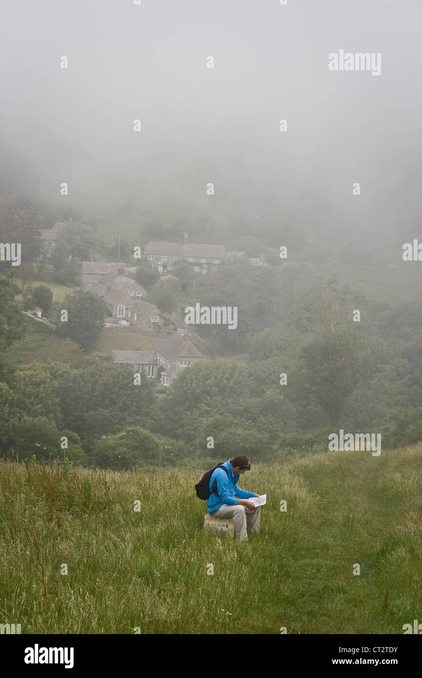 heavy mist or fog over a rural countryside village Stock Photo - Alamy