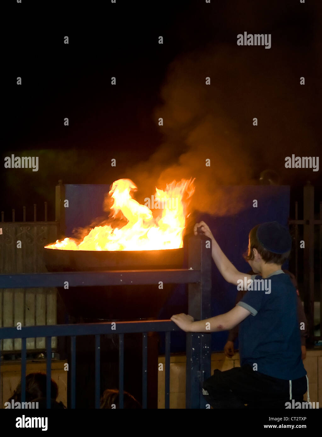 Jewish boy near a bonfire during Lag Ba'omer in Bar Yochai tomb in ...