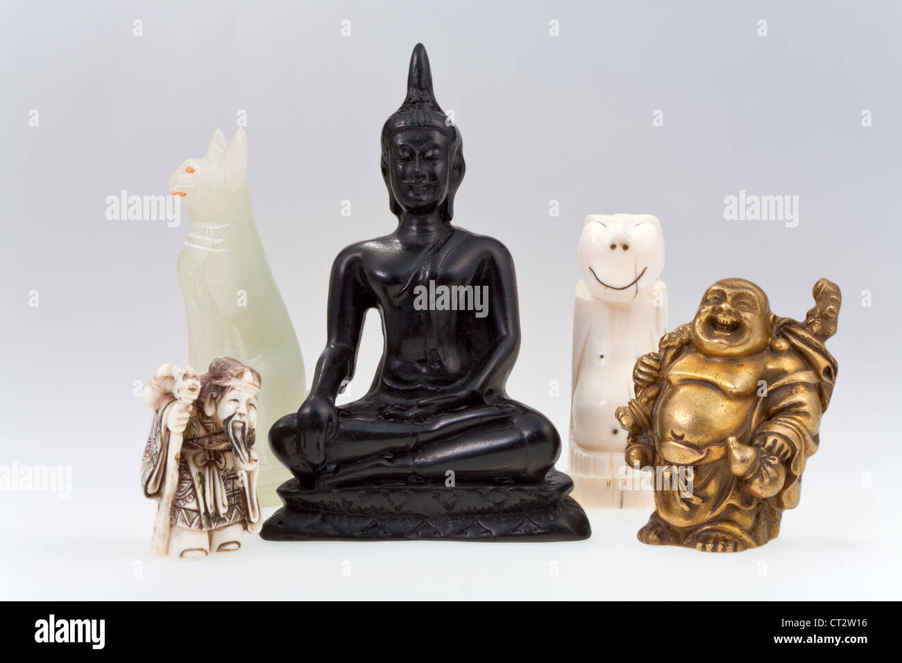 small gods - statuettes of different gods on grey background Stock ...