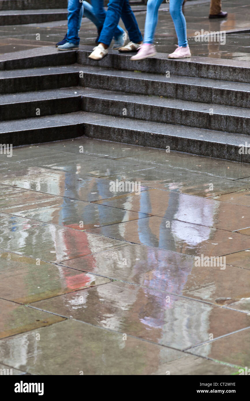 A Very Wet Summers day in London with Reflection of Passers-by on Wet ...