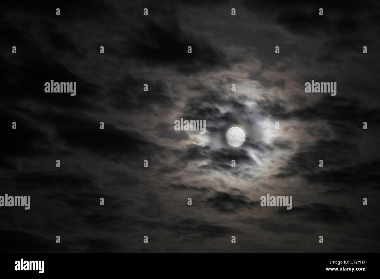 Moon, full moon. Slightly cloudy night sky, the moon shining brightly ...