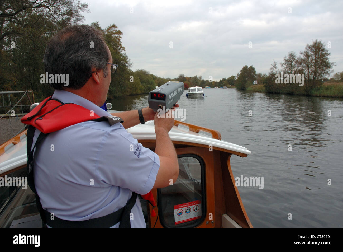 Broads Authority Navigation Officer using radar speed gun on the River ...
