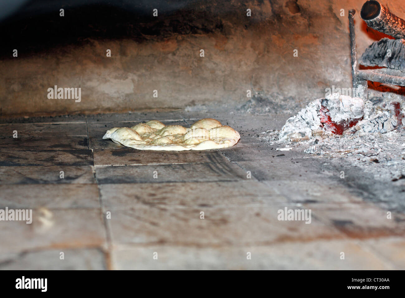 Baking bread in a traditional Turkish brick oven. Turkey Stock Photo ...