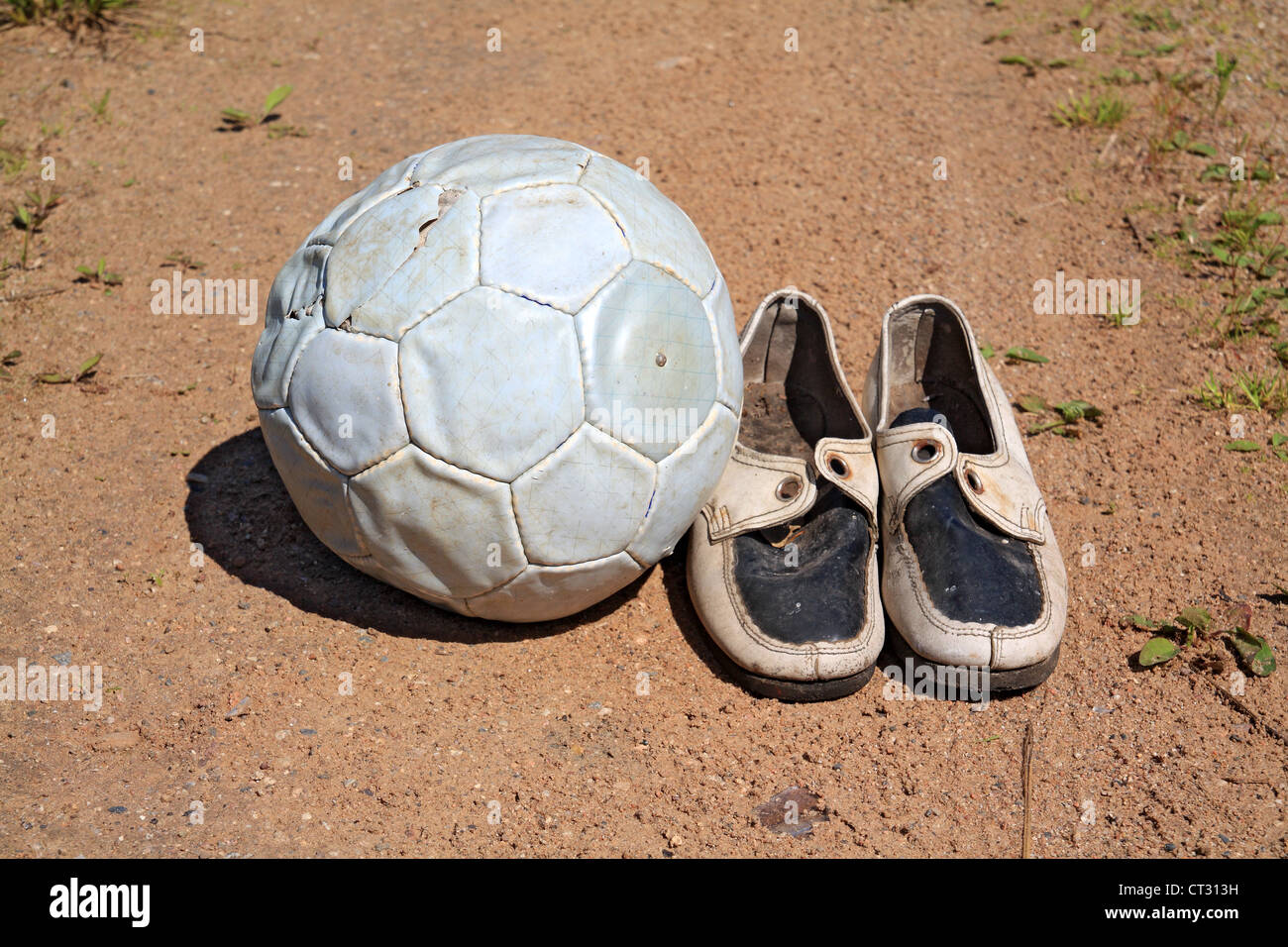 shabby shoe on rural road Stock Photo - Alamy