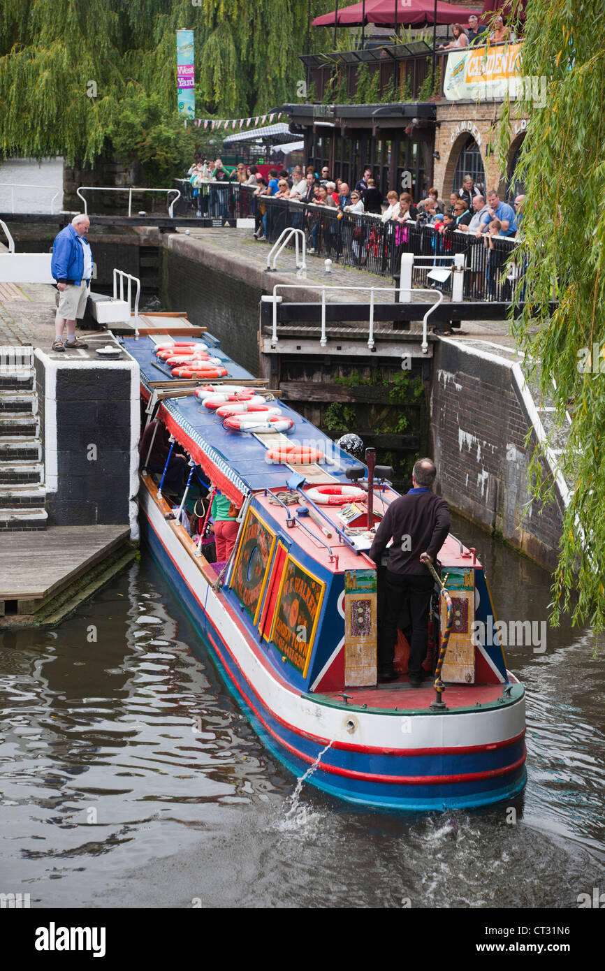 Narrow boat on Regent's Canal entering the lock next to Camden Lock ...