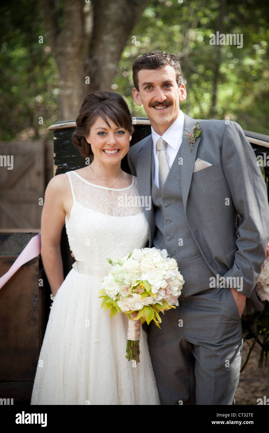 Bride and groom standing beside each other Stock Photo - Alamy