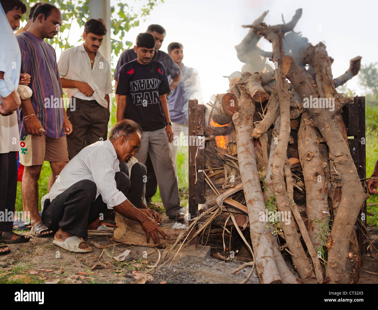 Body being prepared for cremation by the family and friend of deceased ...